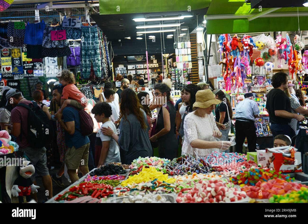 A candy vendor at the vibrant Carmel Market in Tel-Aviv, Israel Stock ...