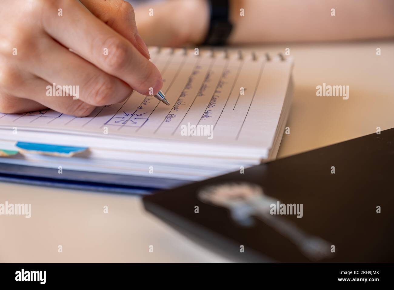 Hand writing notes using ball pen and blue ink Stock Photo - Alamy