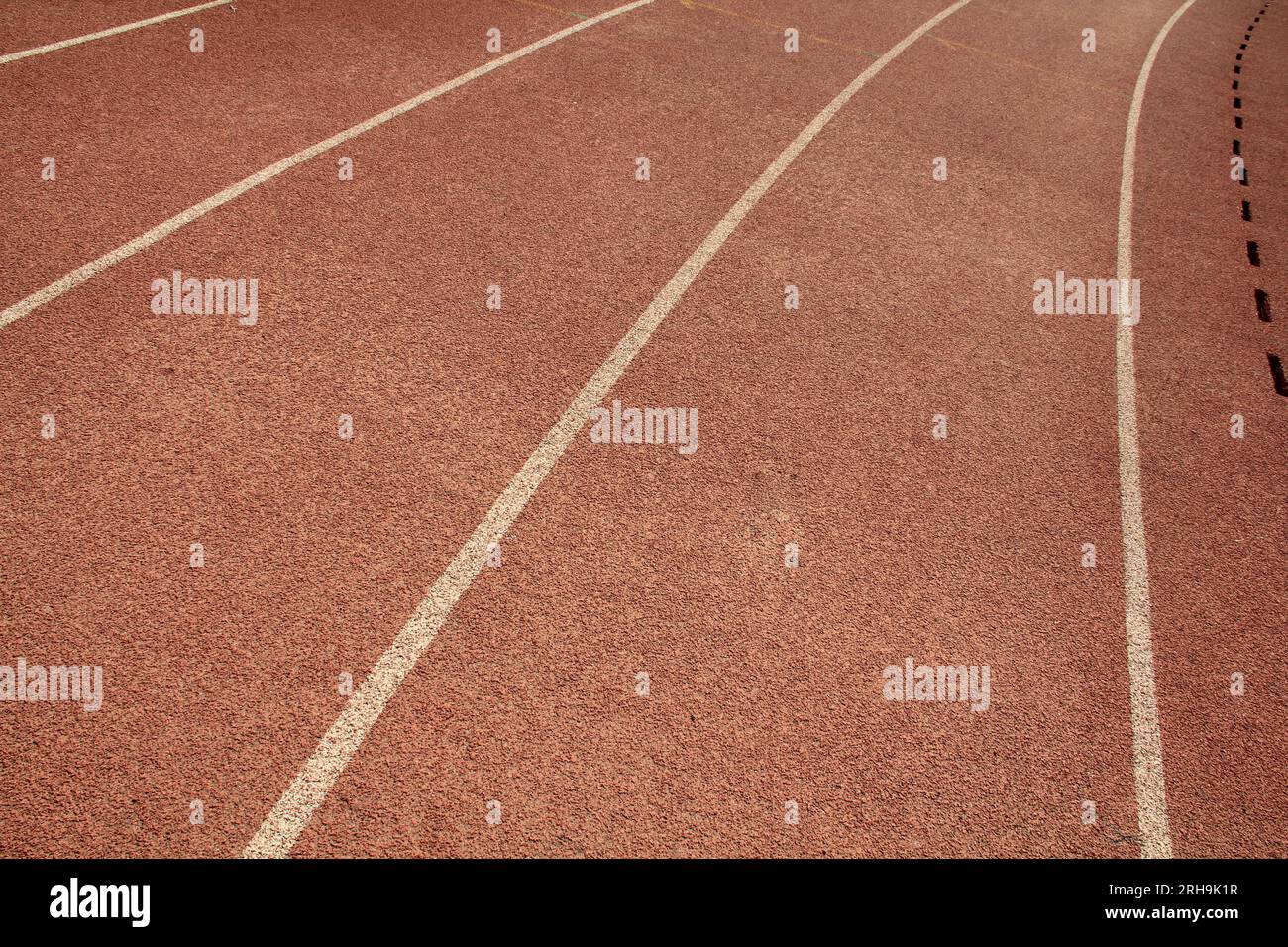 red plastic runway in a sports ground Stock Photo - Alamy