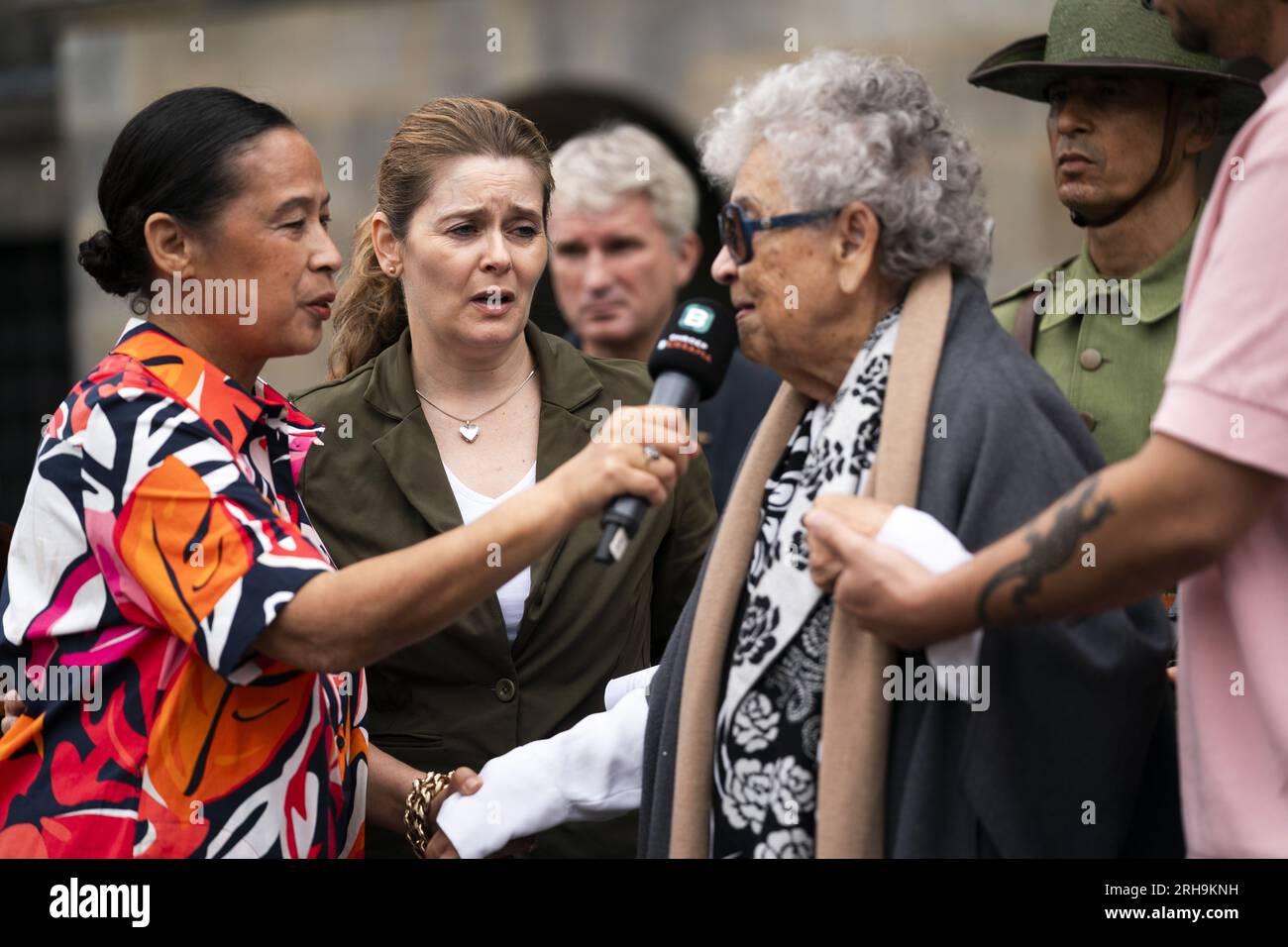 AMSTERDAM - Palmyra Westerling speaks to a woman who was rescued in ...