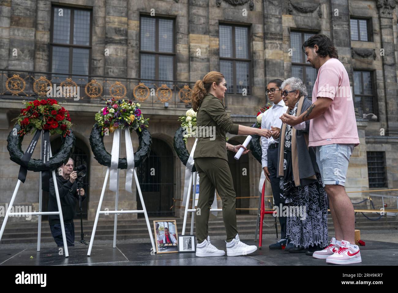 AMSTERDAM - Palmyra Westerling speaks to a woman who was rescued in ...