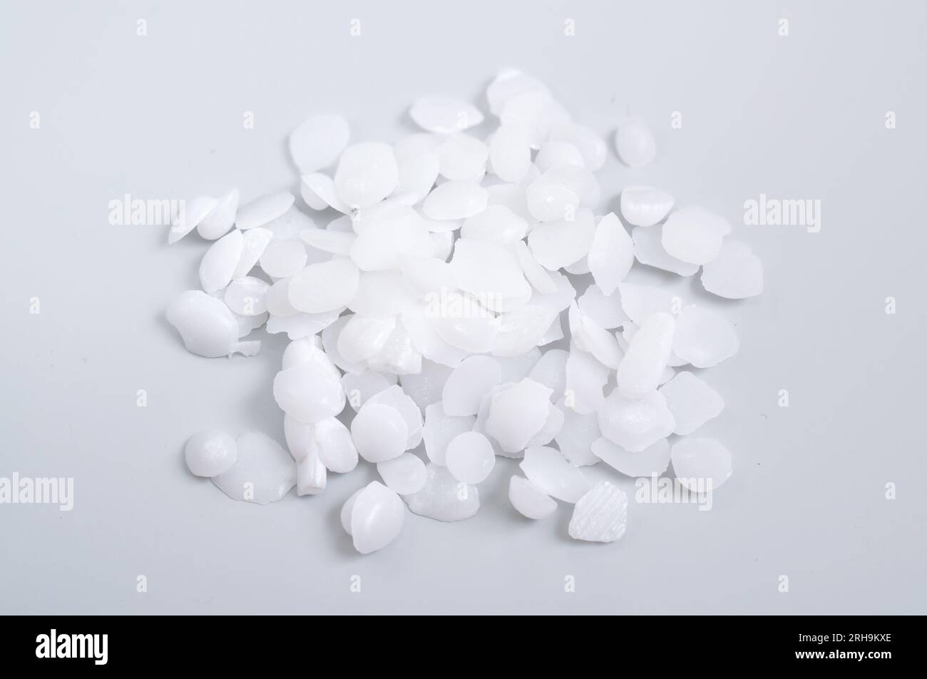 Potassium hydroxide or caustic potash on light grey background Stock ...