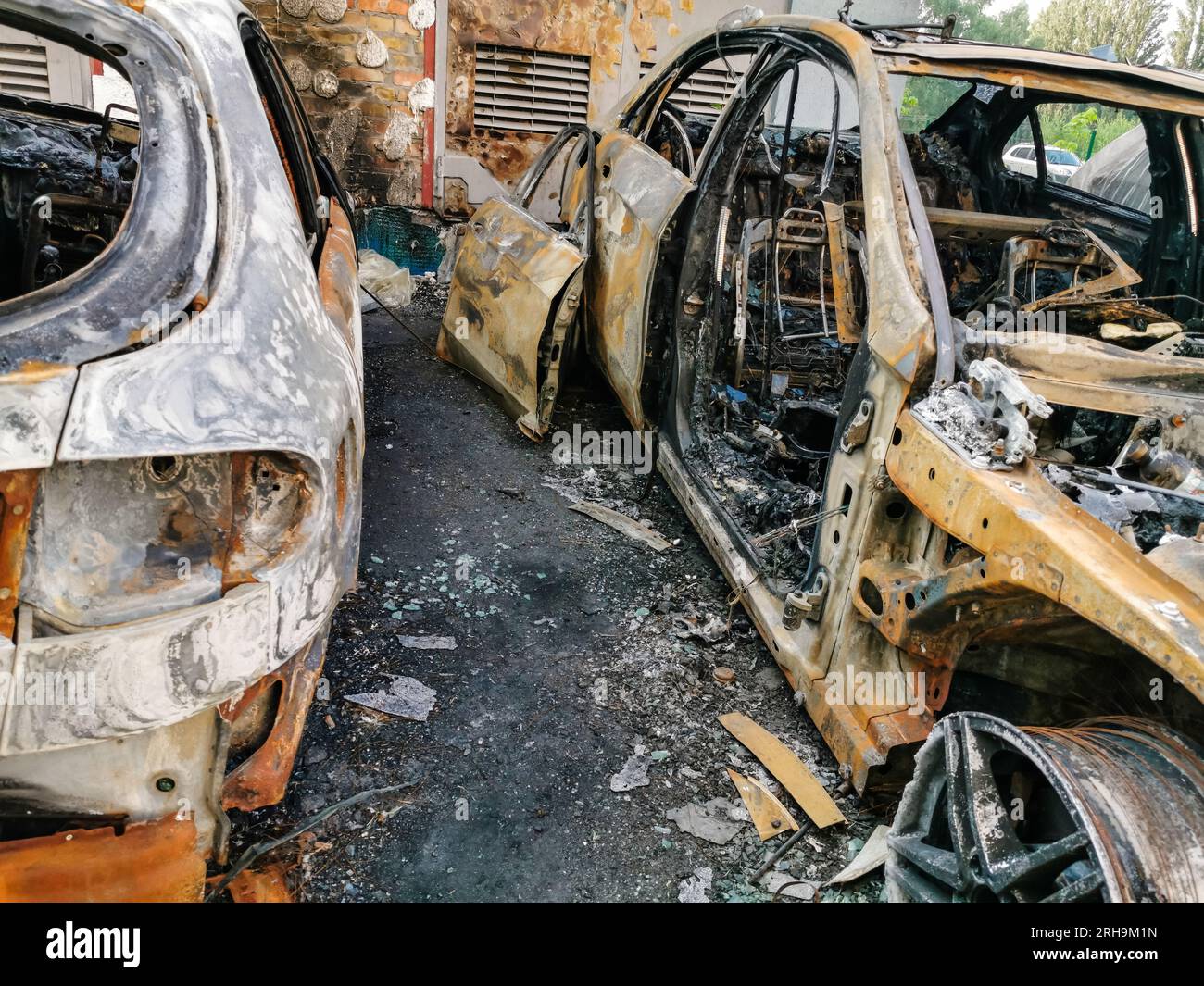 Broken and burned cars in the parking lot, accident or deliberate ...