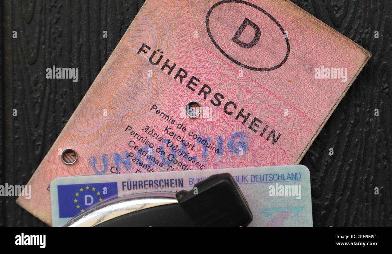an old and new German driving license with the inscription ...