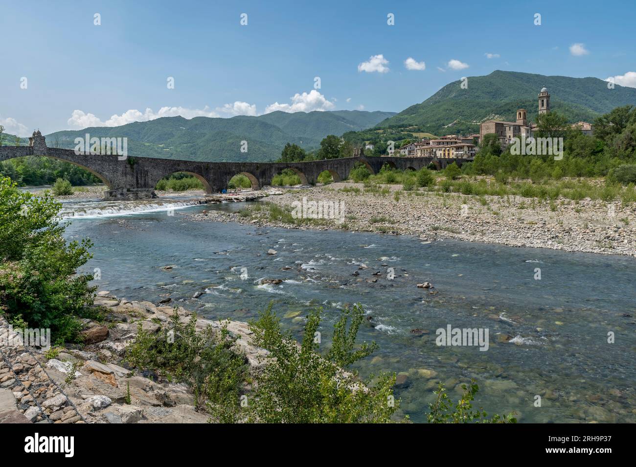 Panoramic view of Bobbio, Italy, and its famous hunchback bridge on a ...