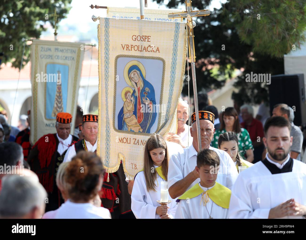Vrpolje, Croatia. 15th Aug, 2023. People carry statue of a Virigin Mary ...