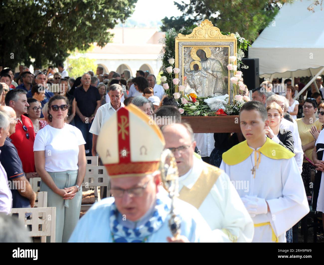 Vrpolje, Croatia. 15th Aug, 2023. People carry statue of a Virigin Mary ...