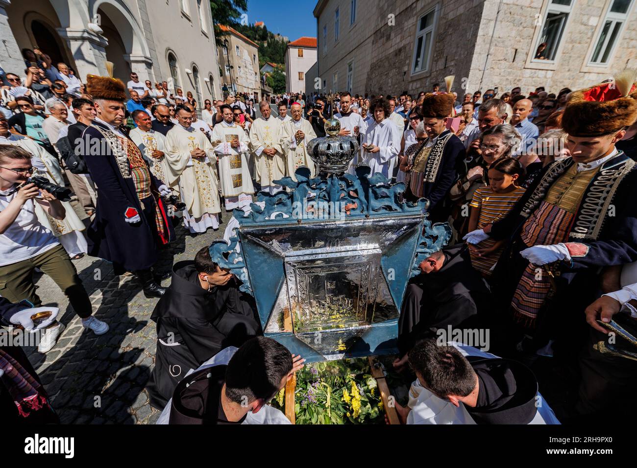 Sinj, Croatia. 15th Aug, 2023. Roman Catholic priests carry The ...