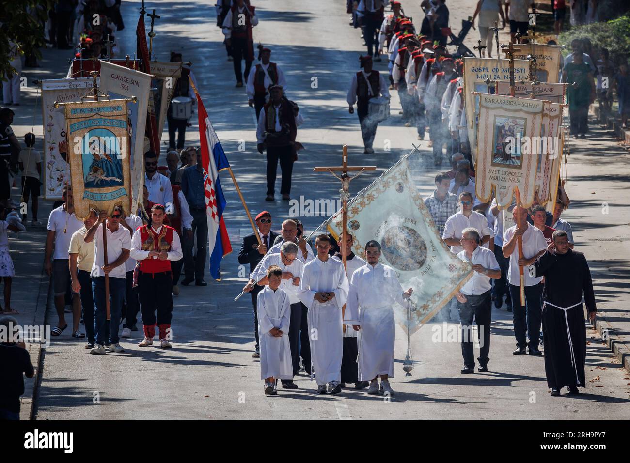 Sinj, Croatia. 15th Aug, 2023. Roman Catholic priests carry The ...