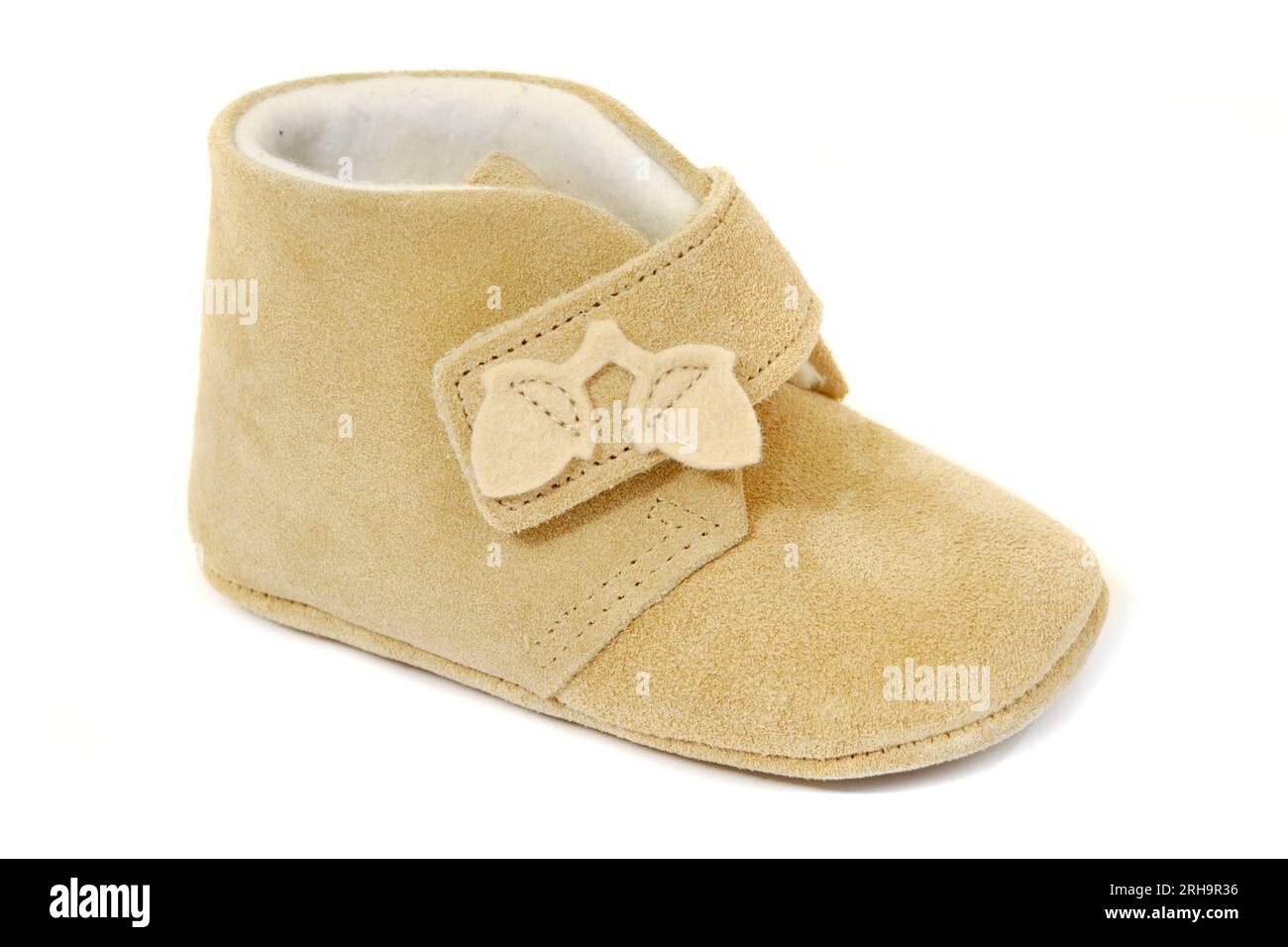 A sweet baby shoe taken on a clean white background Stock Photo - Alamy