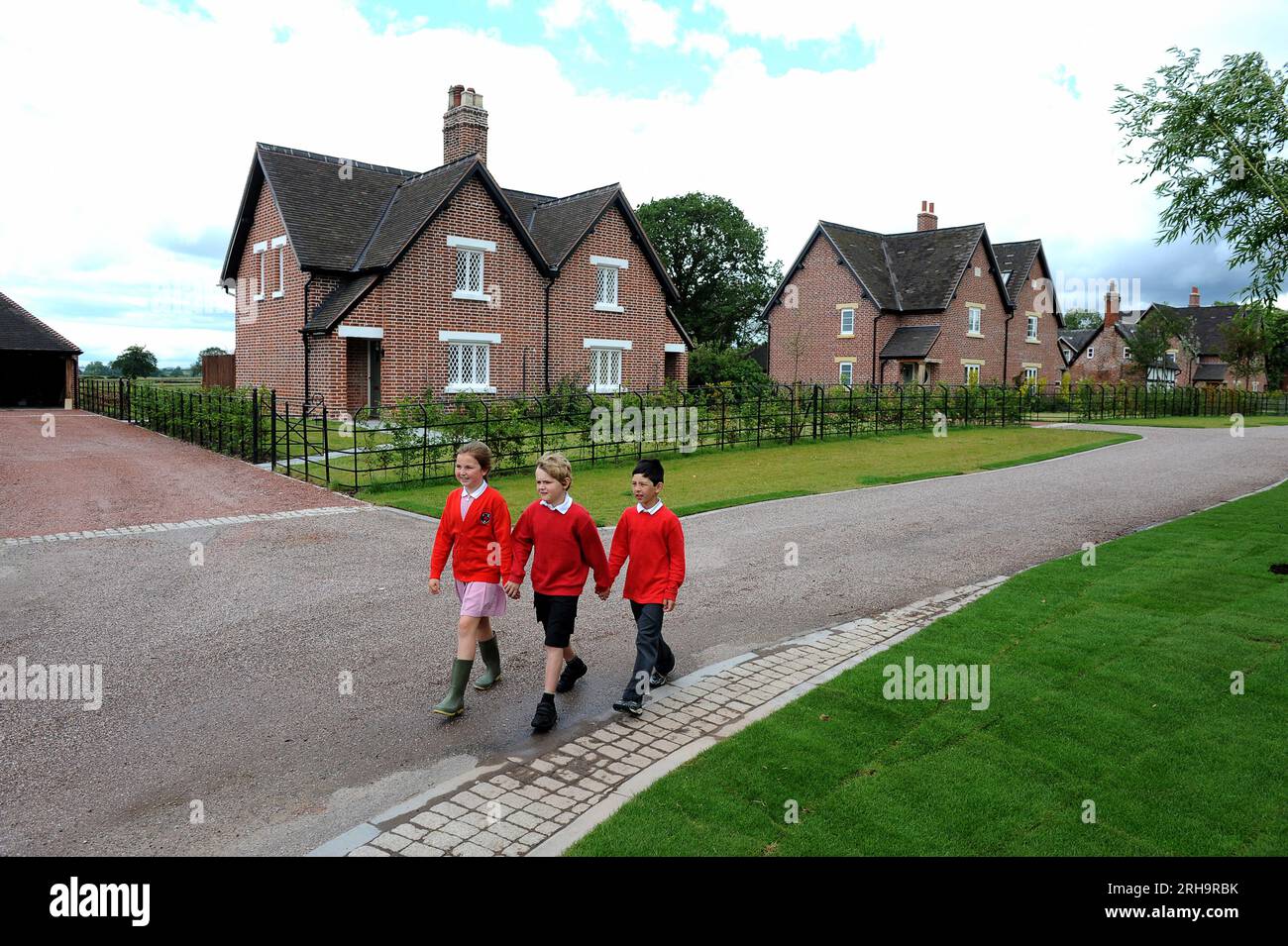 School children walking through the village of Burnhill Green, South ...