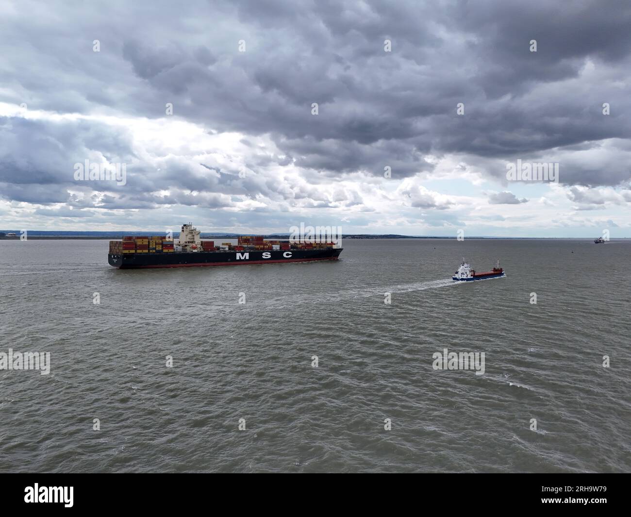 MSC Madeleine container ship along side another ship Thames Estuary UK ...