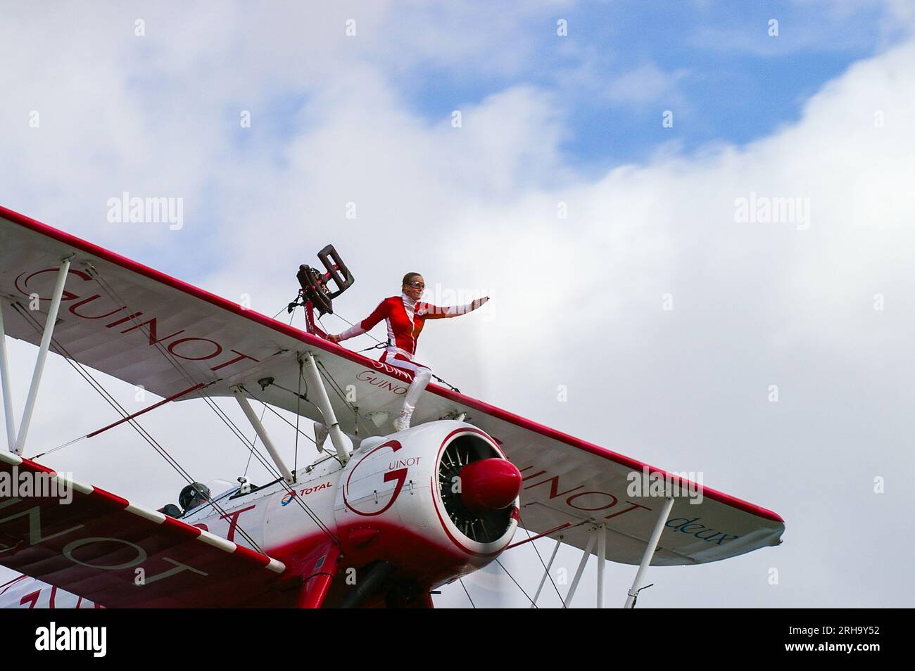 AeroSuperBatics wingwalking team flying at an airshow. Wingwalker ...