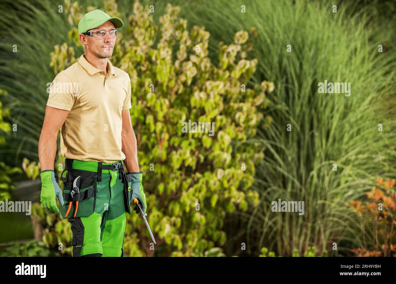 Happy Professional Caucasian Gardener in His 40s with Tools in His ...