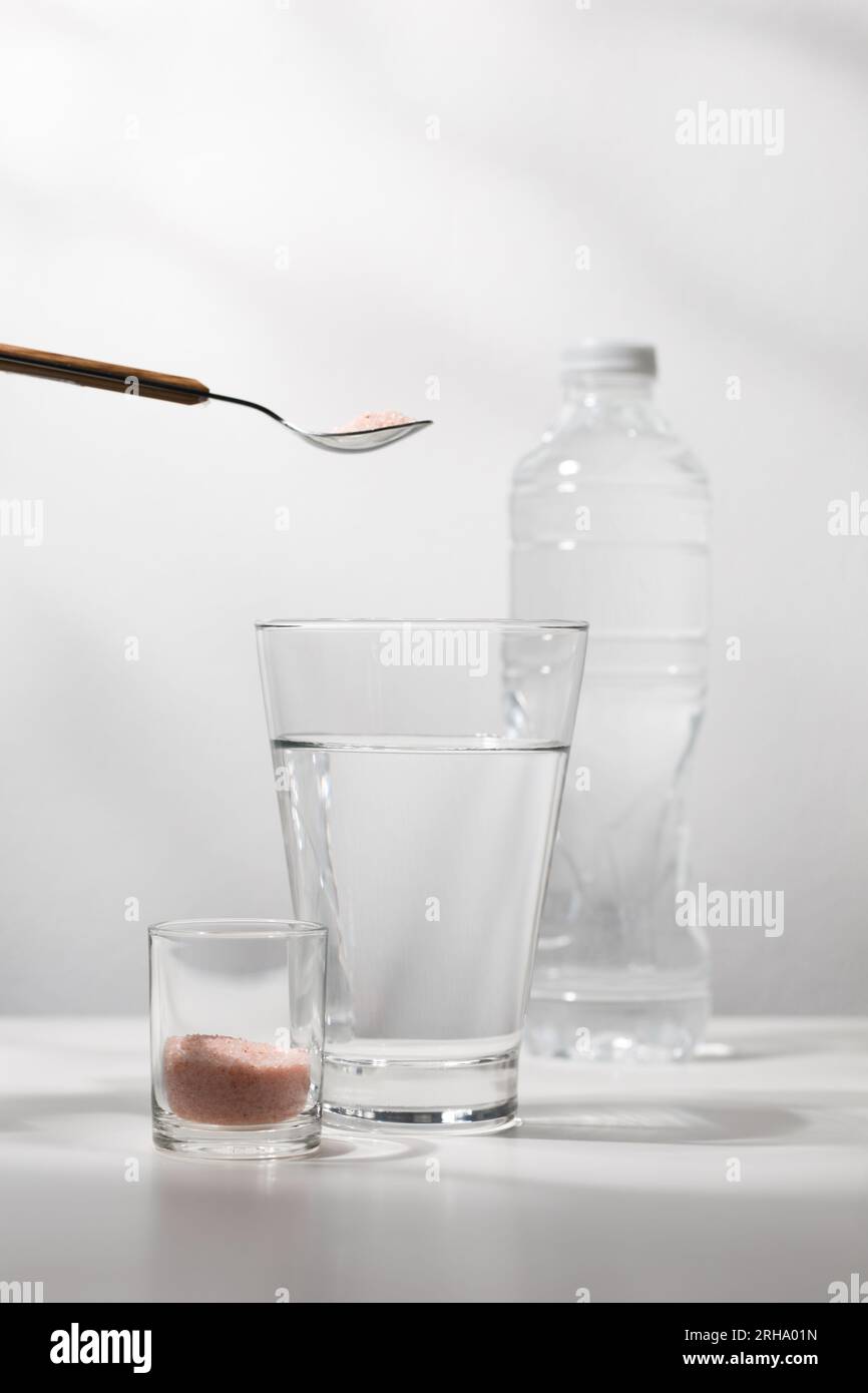 Mix pink himalayan mineral salt to drinking water for health Stock ...