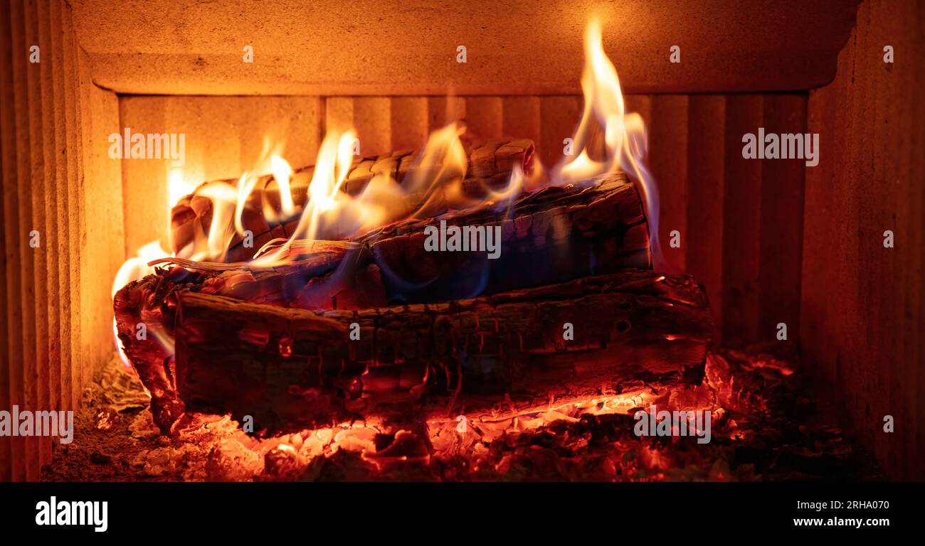 Fireplace close up, fire flame and burning wood logs, warm home in ...