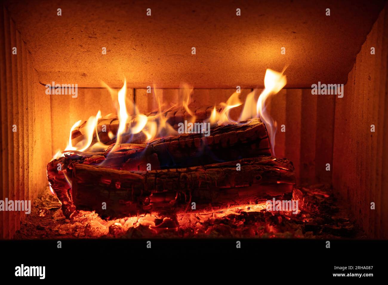Fireplace close up, fire flame and burning wood logs, warm home in ...