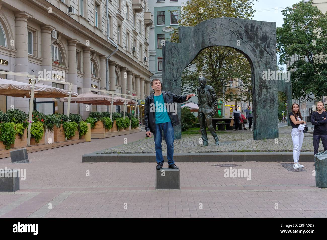The poet reads poetry to passers-by on Stary Arbat Street in front of ...