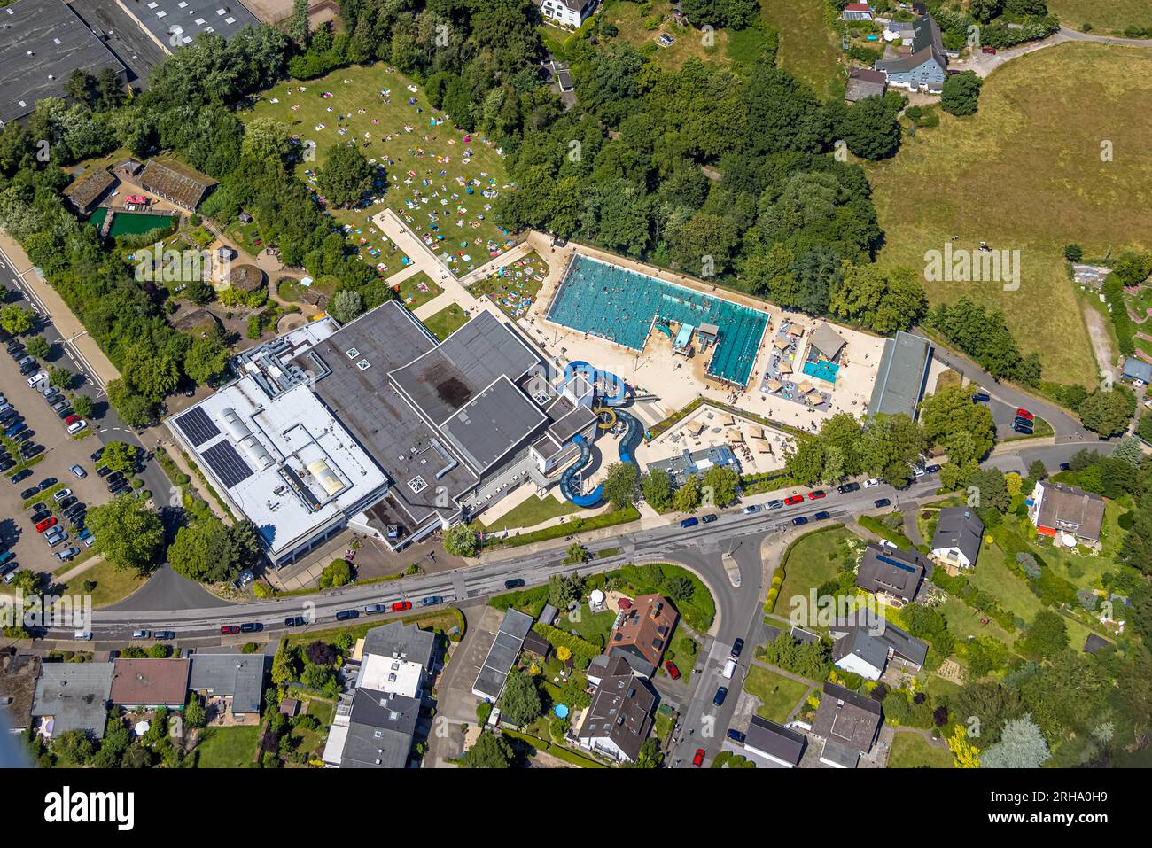Aerial view, outdoor pool swimming in, sunbathing lawn, water slide ...
