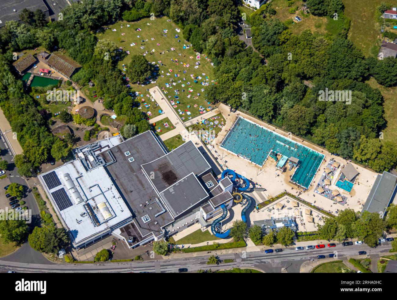 Aerial view, outdoor pool swimming in, sunbathing lawn, water slide ...