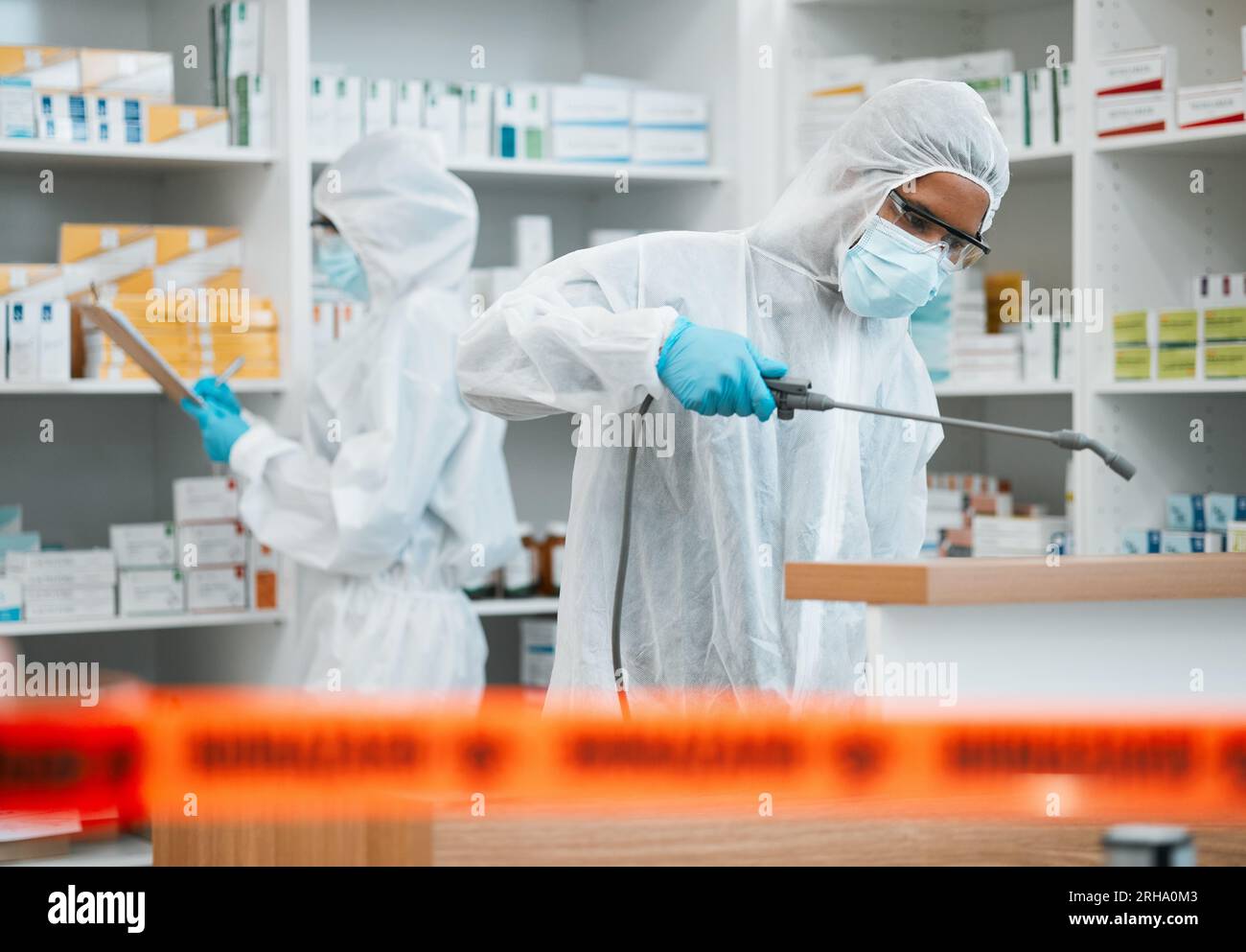 Hazmat, chemical and disinfect with people in a pharmacy for ...