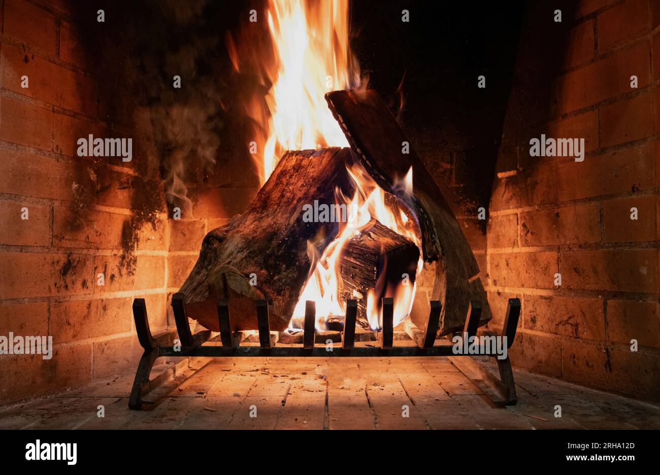 Fireplace close up, fire flame and burning wood logs, warm home in ...