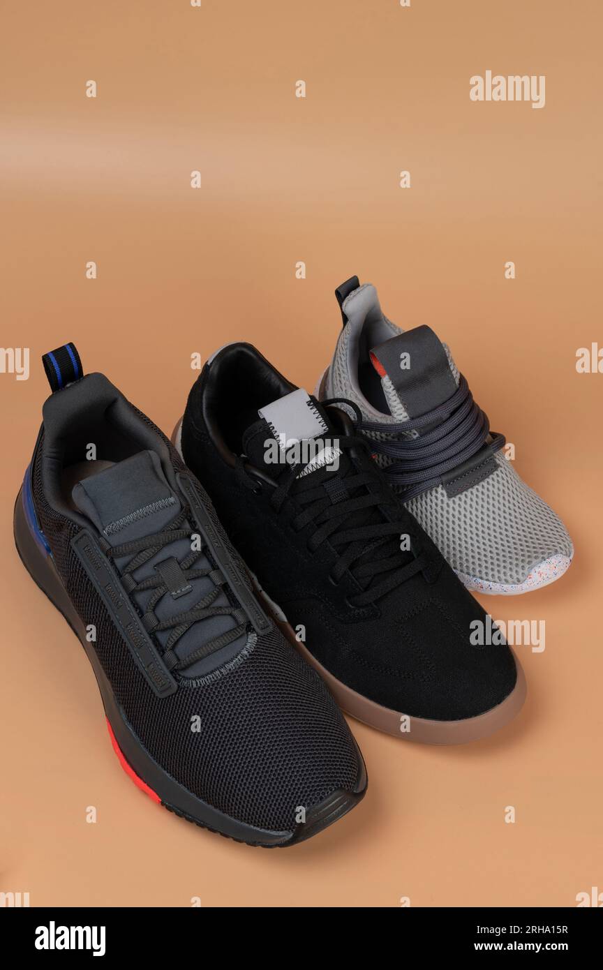 Row of different size sport shoes perspective view isolated on brown ...