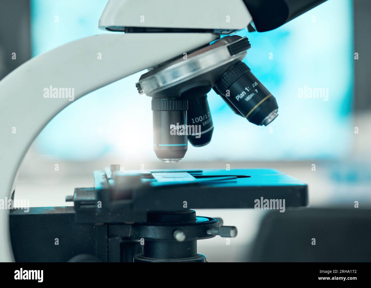 Science, closeup and a microscope for research of bacteria, studying ...