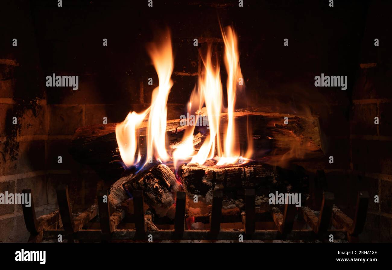 Fireplace close up, fire flame and burning wood logs, warm home in ...