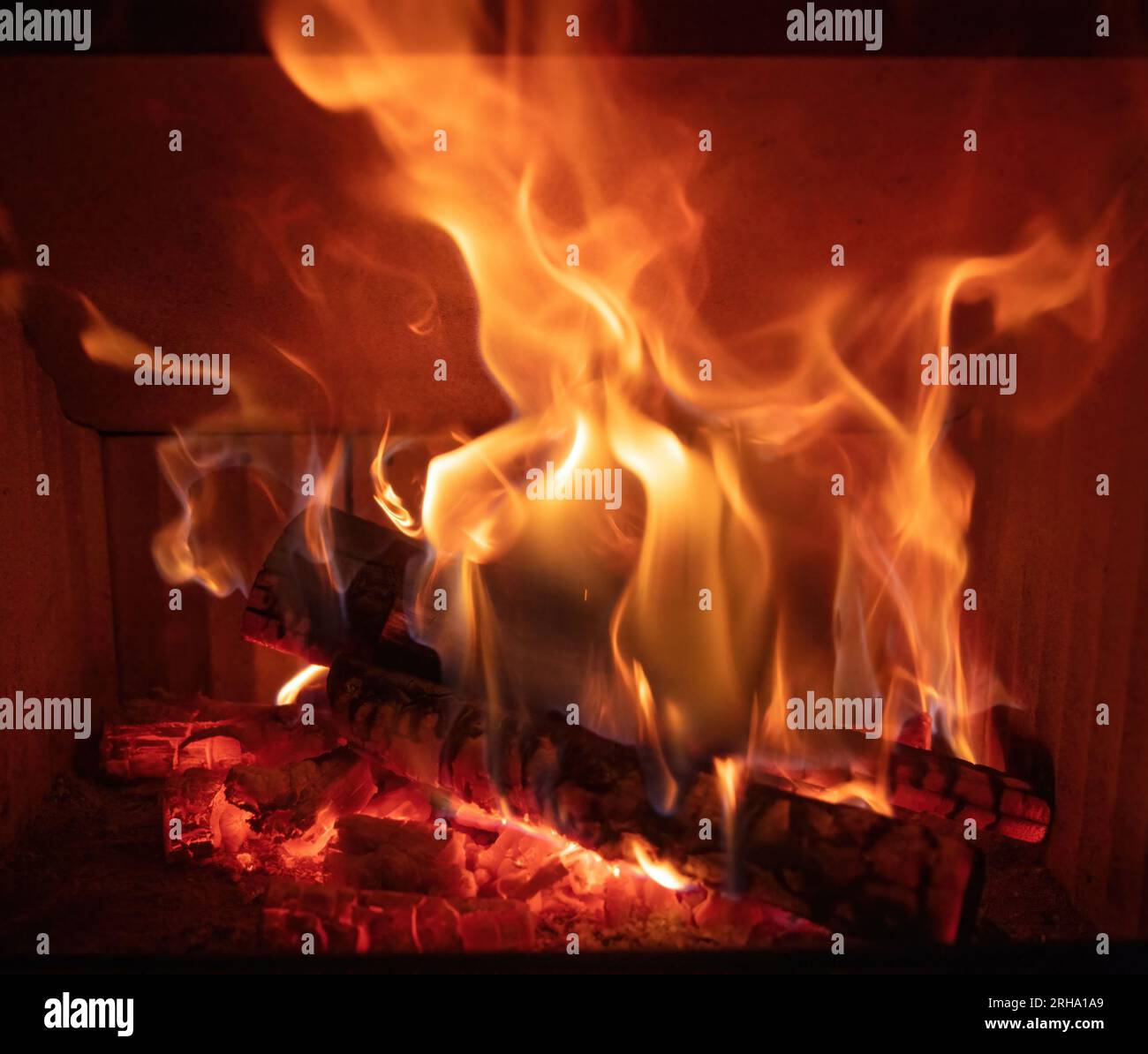 Fire flames and burning wood logs, fireplace close up, Warm home in ...