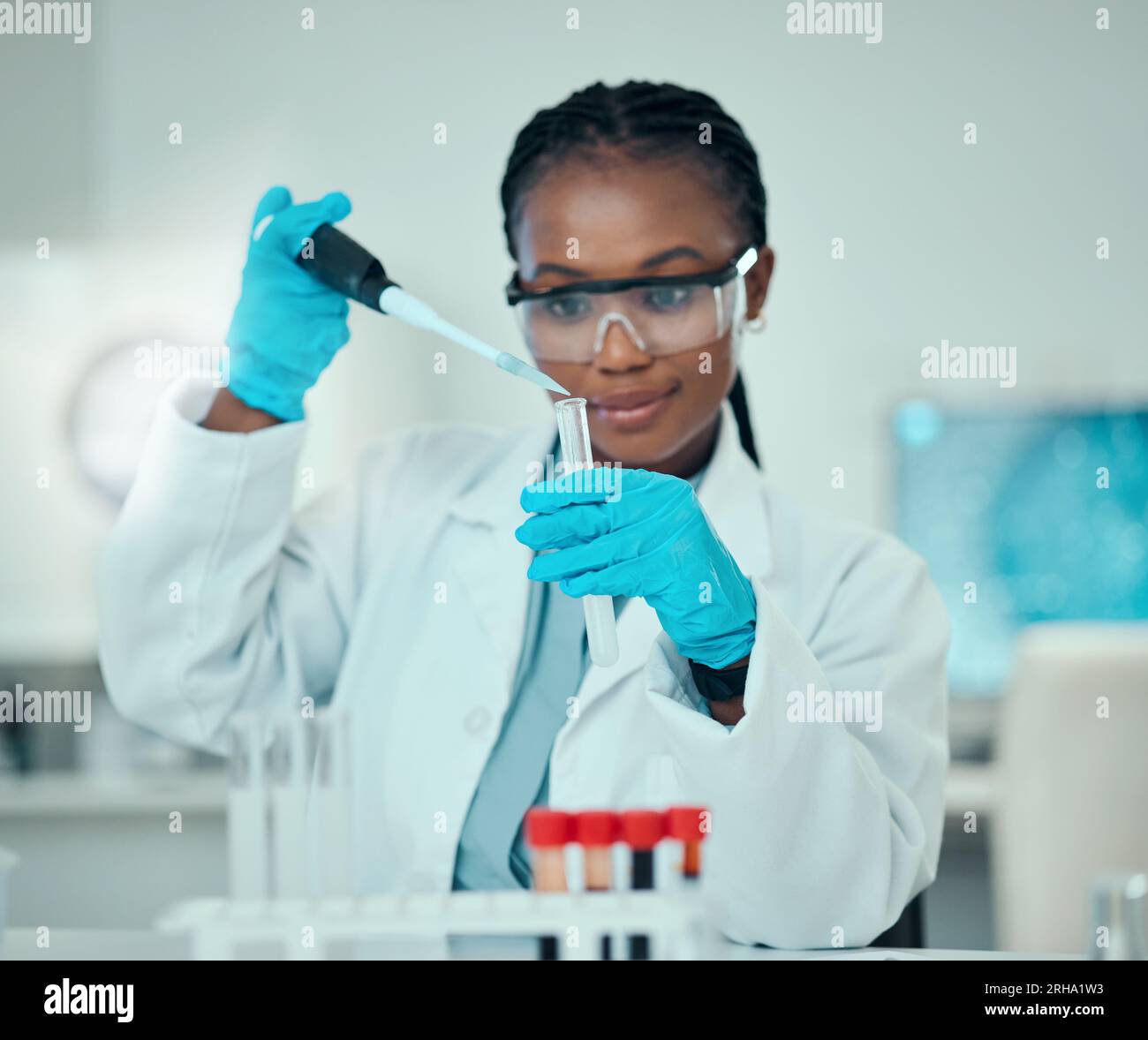 Science, safety and research, black woman with pipette in laboratory ...
