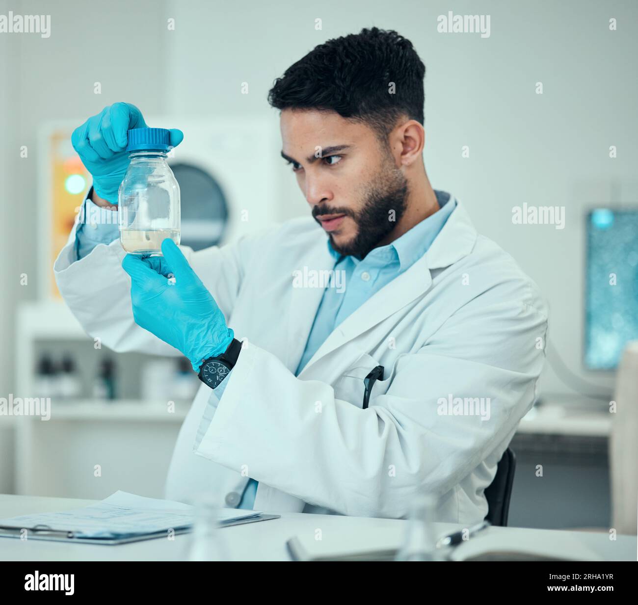 Science, results and man with bottle in laboratory, research and ...