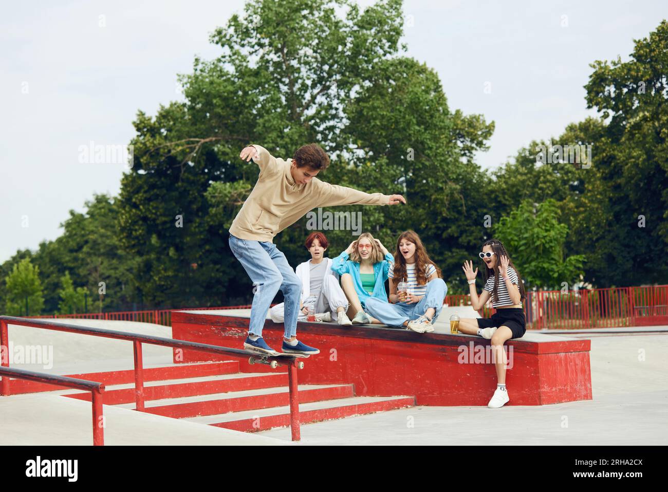 Friends meeting on skaet park, outdoors, skateboarding, training ...
