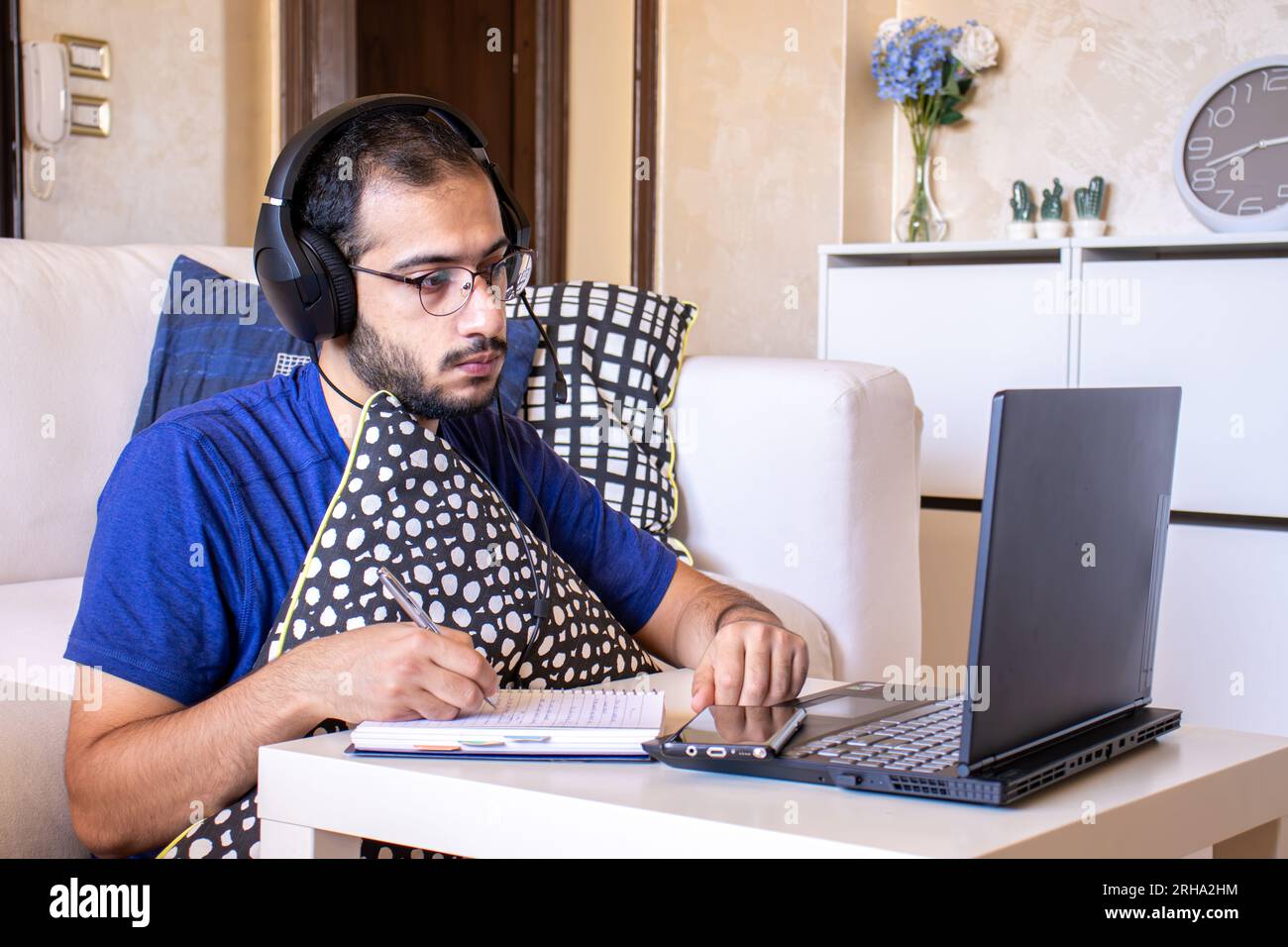 Young arabic man studying remotely Stock Photo - Alamy