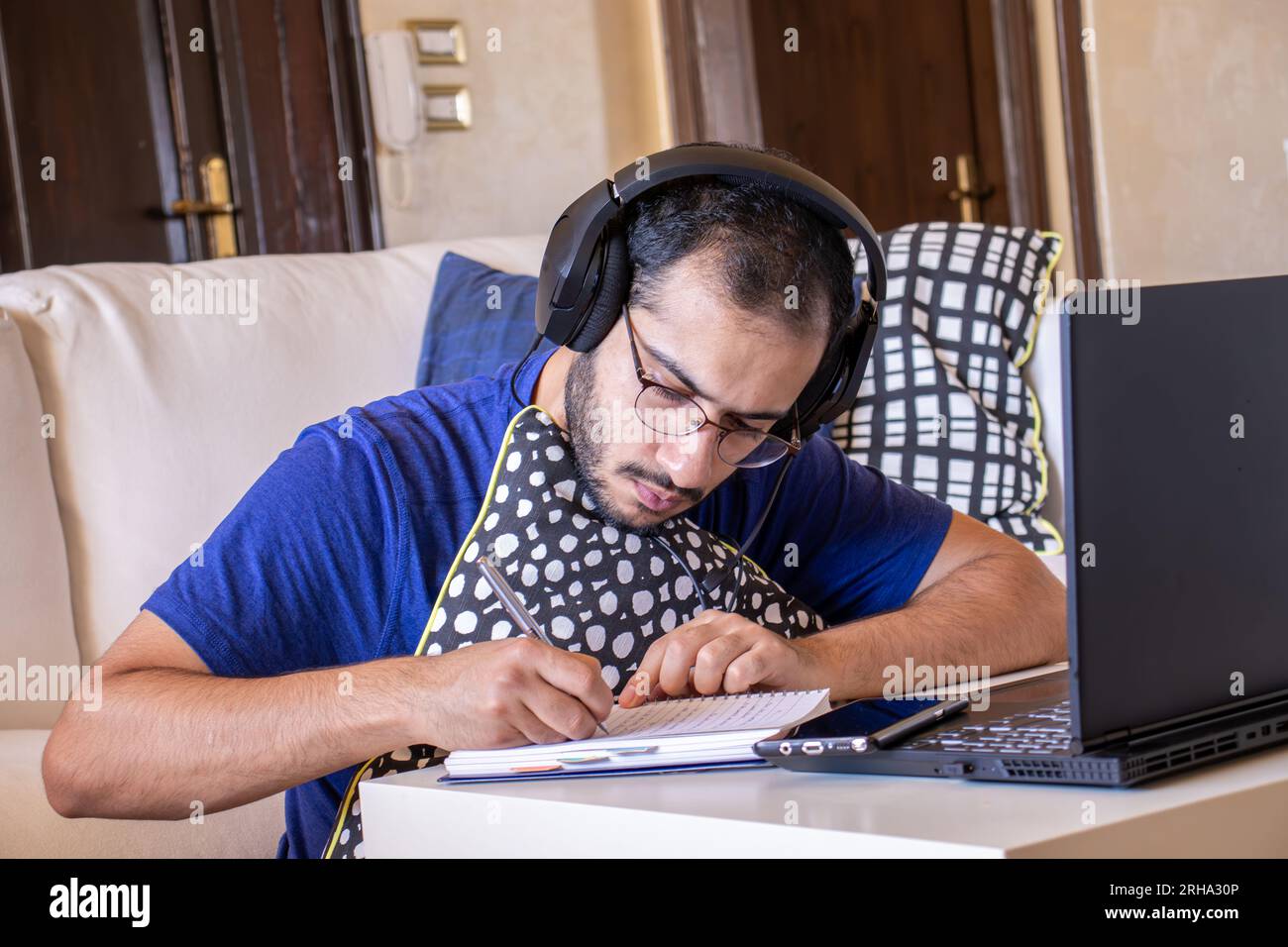 Young arabic man studying remotely Stock Photo - Alamy