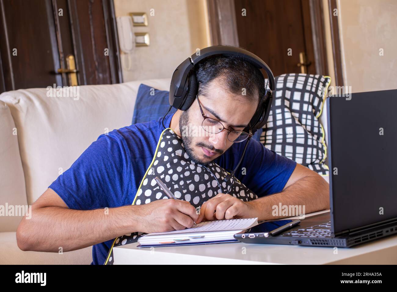 Young arabic man studying remotely Stock Photo - Alamy