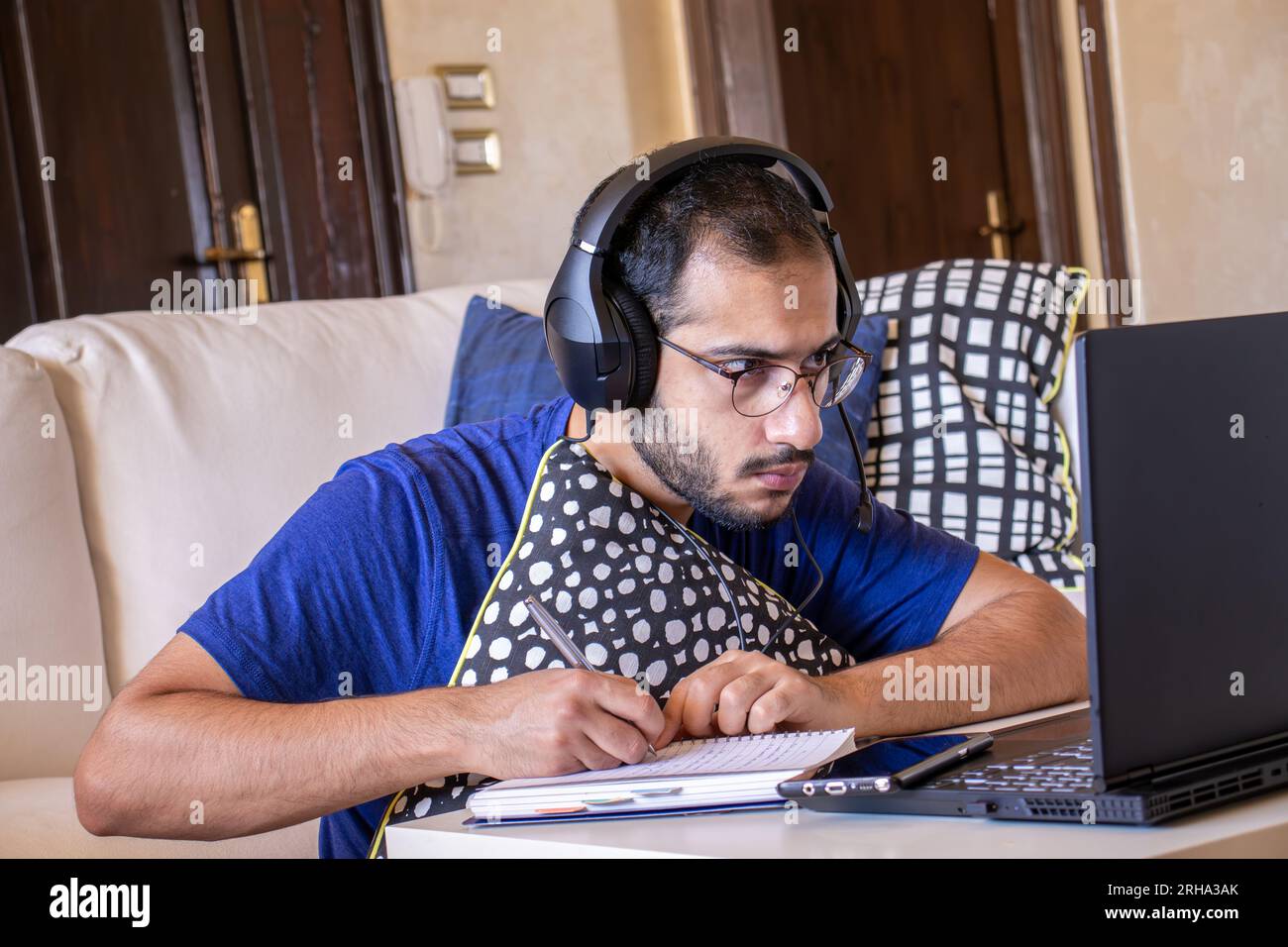Young arabic man studying remotely Stock Photo - Alamy