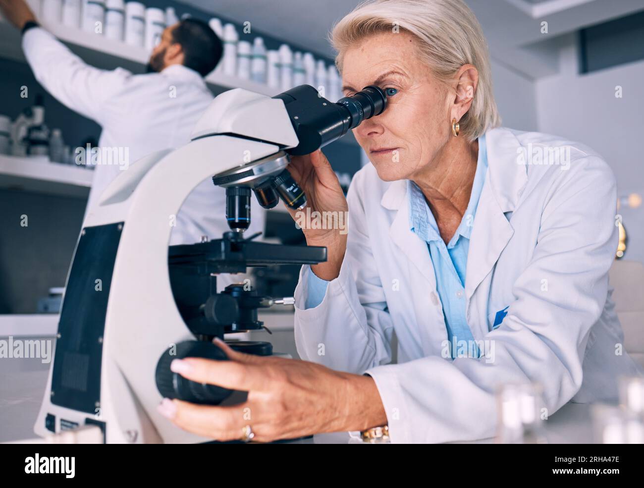 Microscope, research and woman science professional analysis on a ...