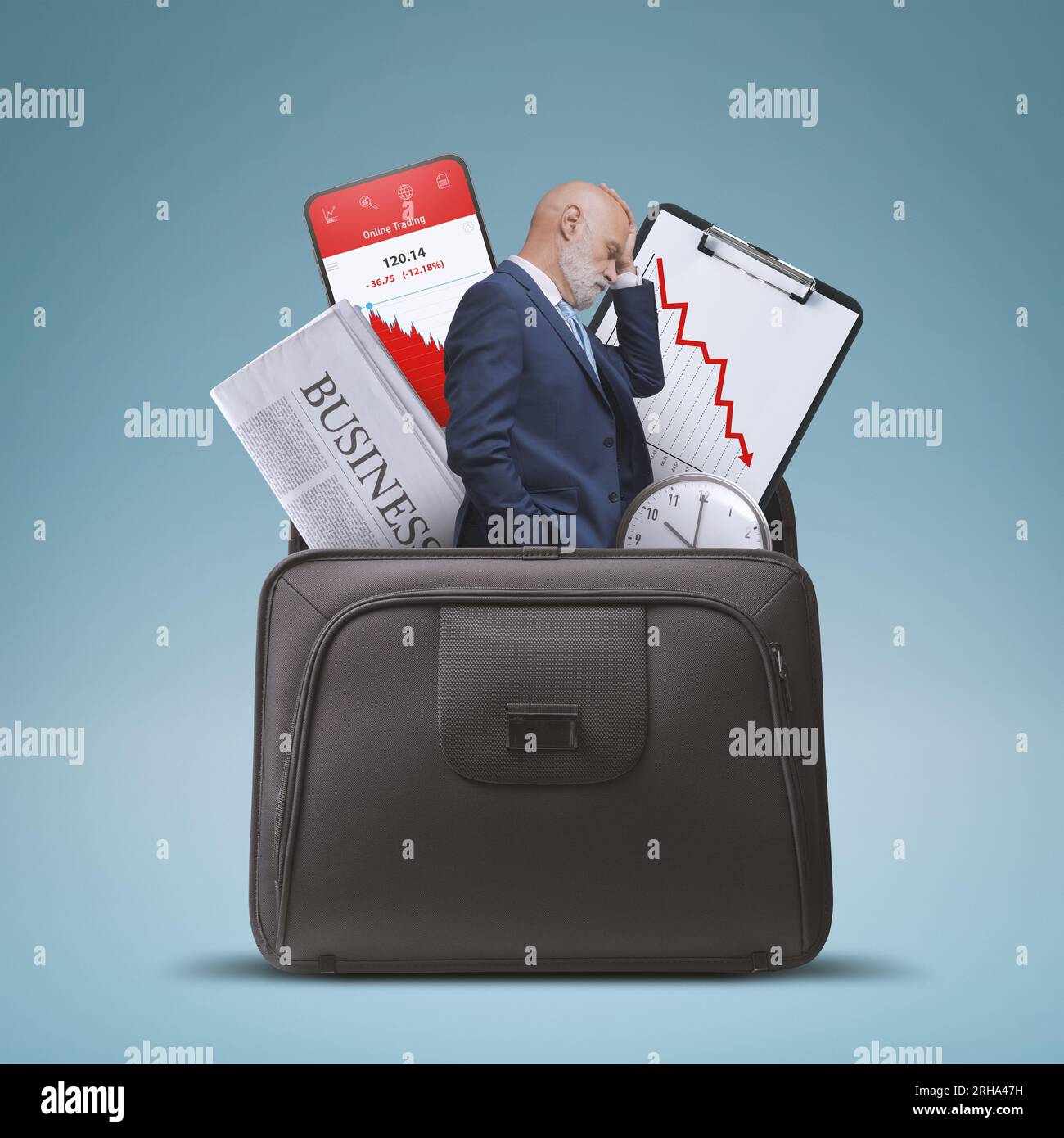 Stressed sad businessman and financial graphs showing loss in a ...