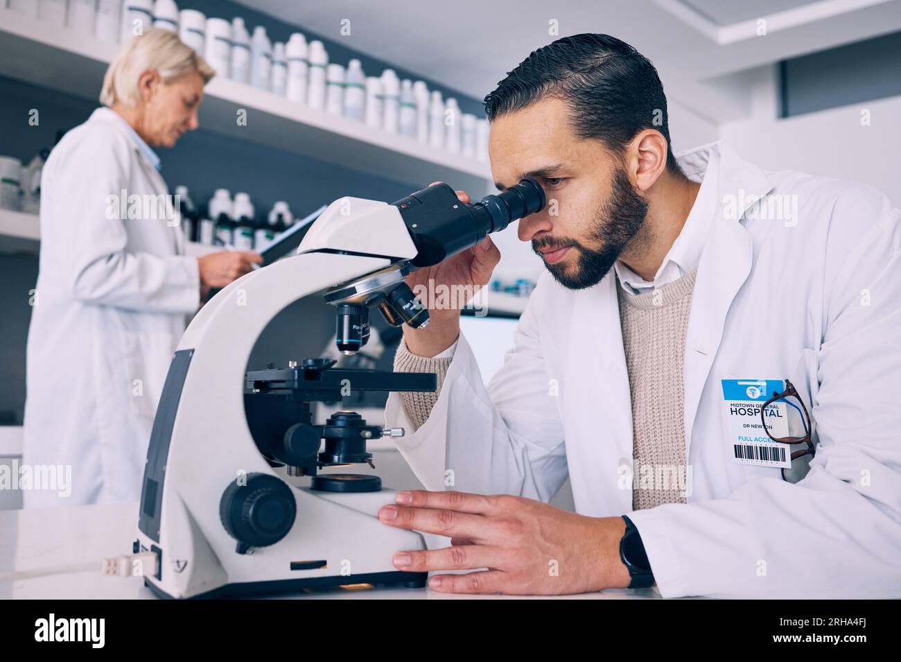 Scientist man, microscope analysis and lab for medical research ...