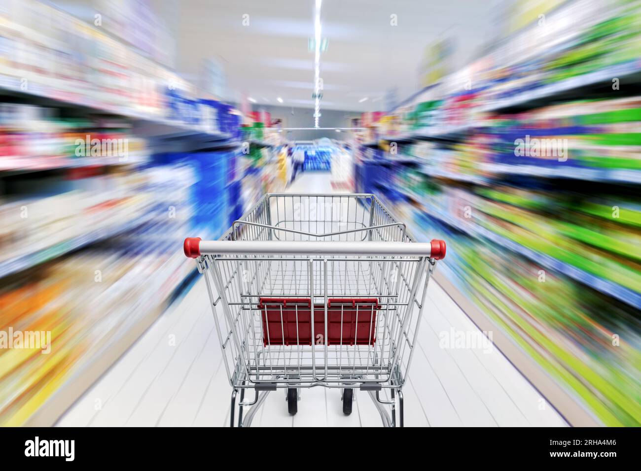 Empty shopping cart in the supermarket aisle, grocery shopping and ...