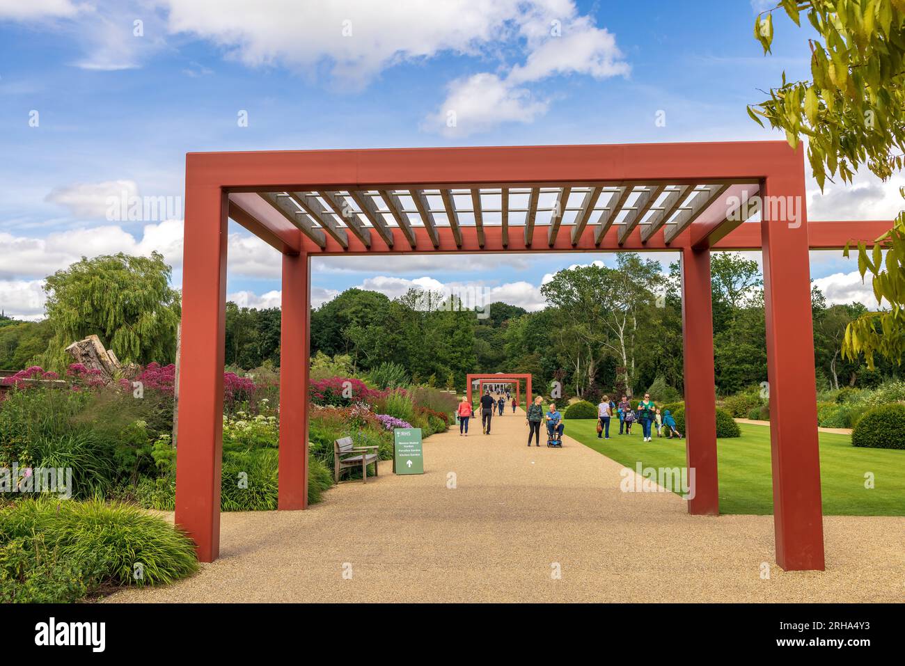 Wide main entrance alley with red arches at the RHS Garden Bridgewater ...