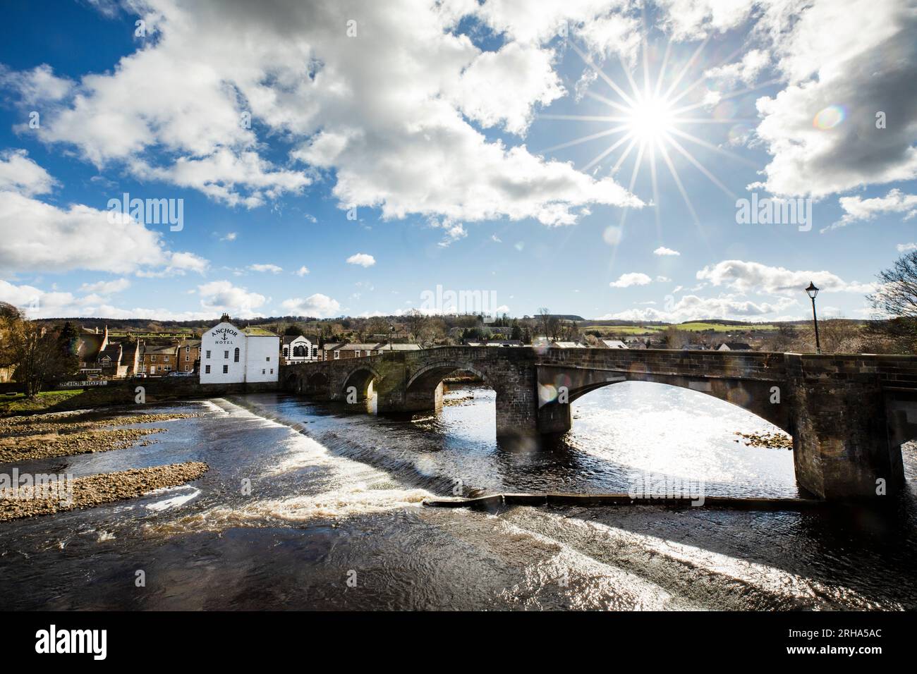 Sunshine over the old bridge over the River South Tyne at Haydon Bridge ...