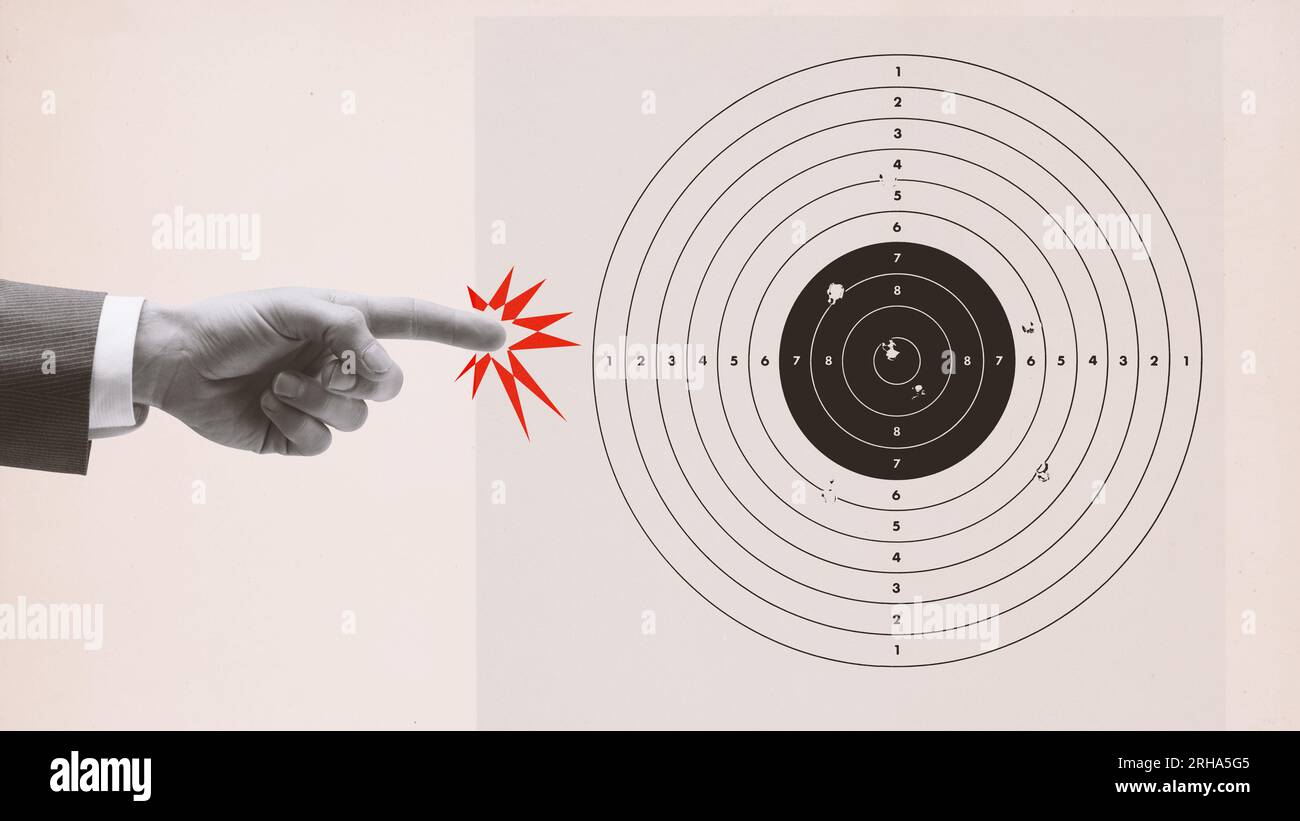Corporate business leader pointing finger and shooting at the target ...