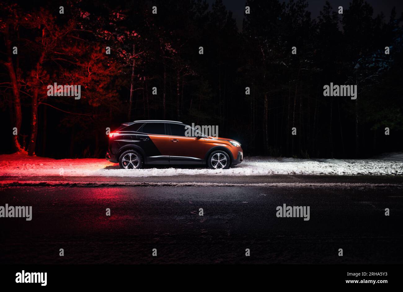side view of Peugeot 3008 GT-line in night forest. two-tone SUV parked ...