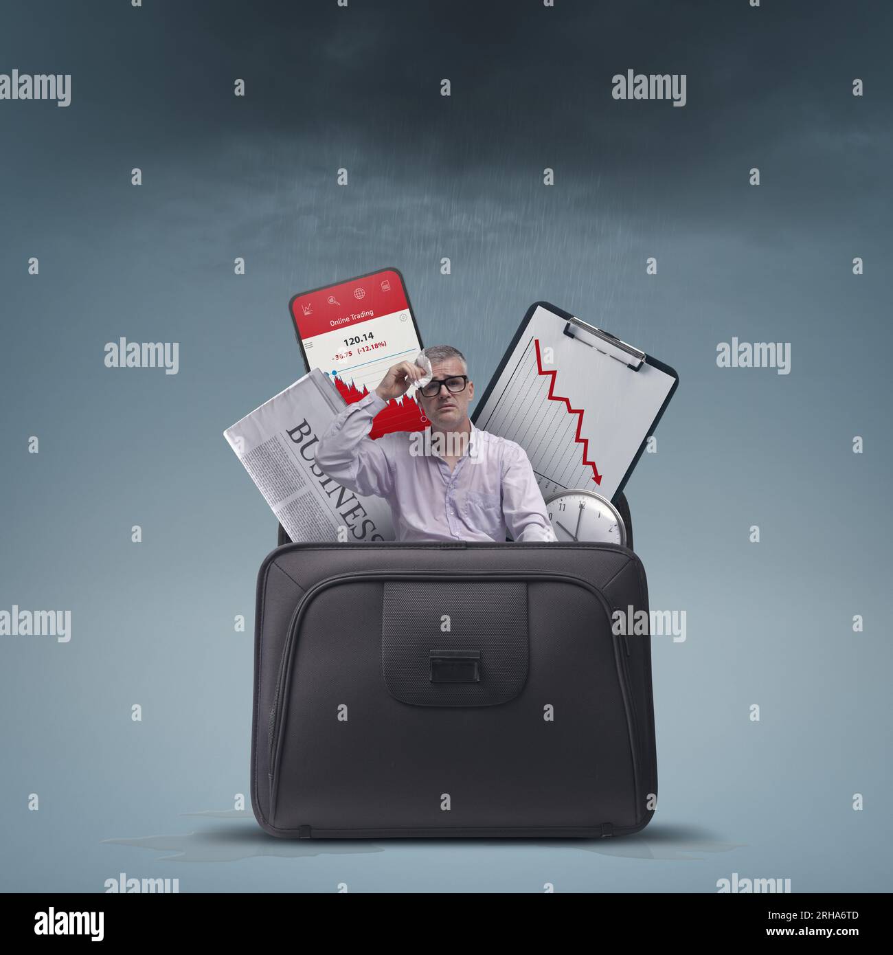 Stressed sad businessman and financial graphs showing loss in a ...