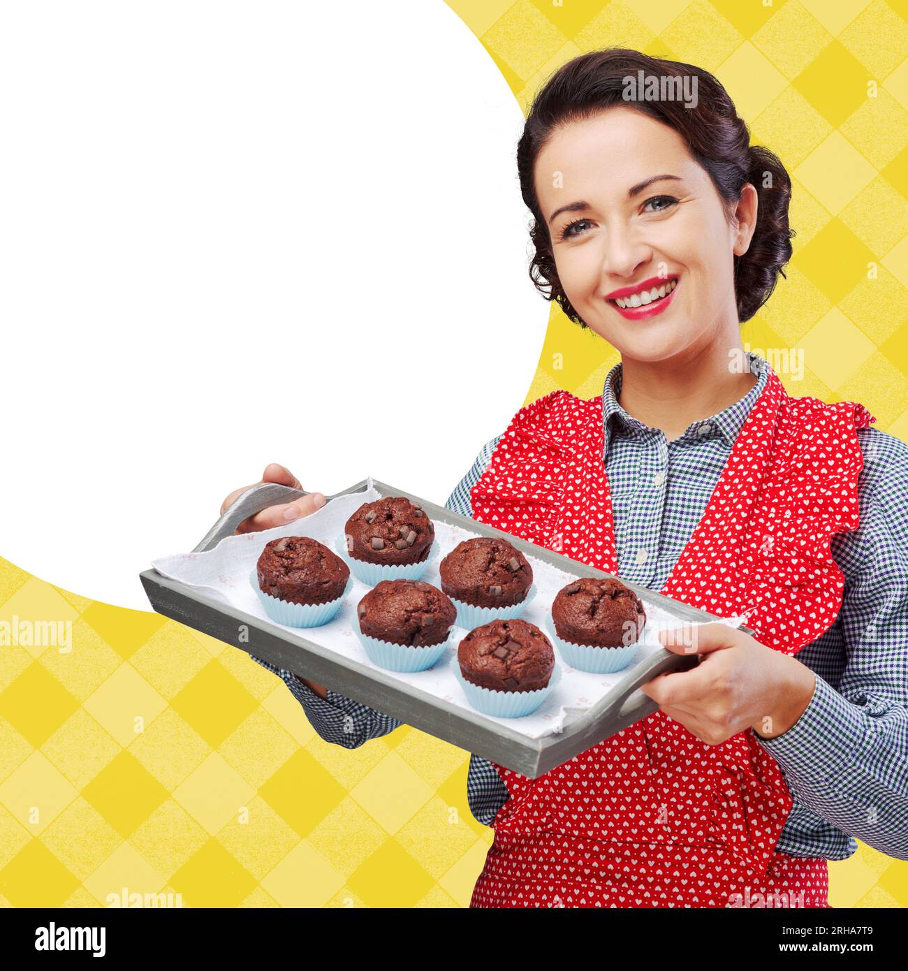 Smiling vintage woman in apron serving homemade chocolate muffins on a ...