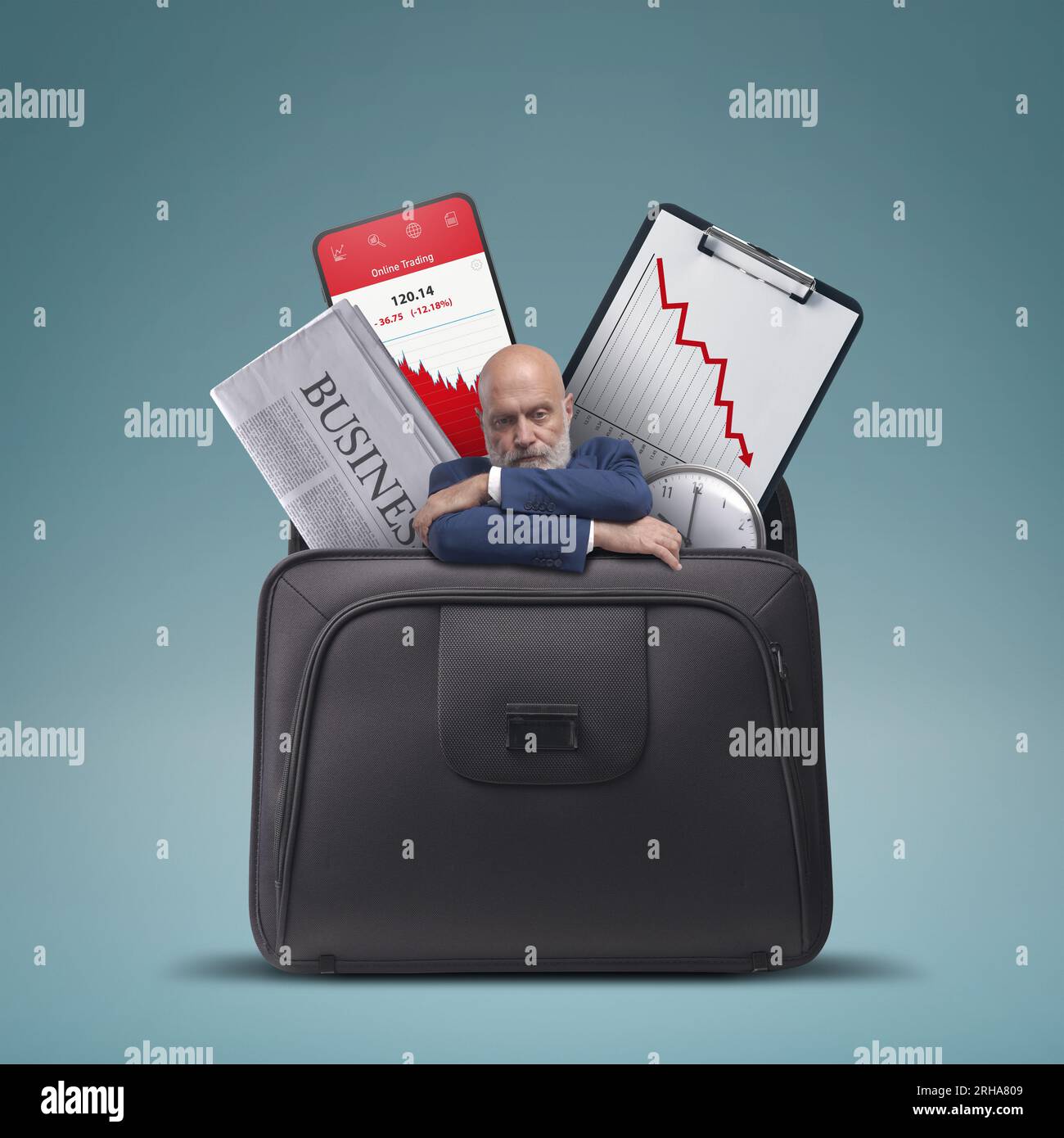 Stressed sad businessman and financial graphs showing loss in a ...