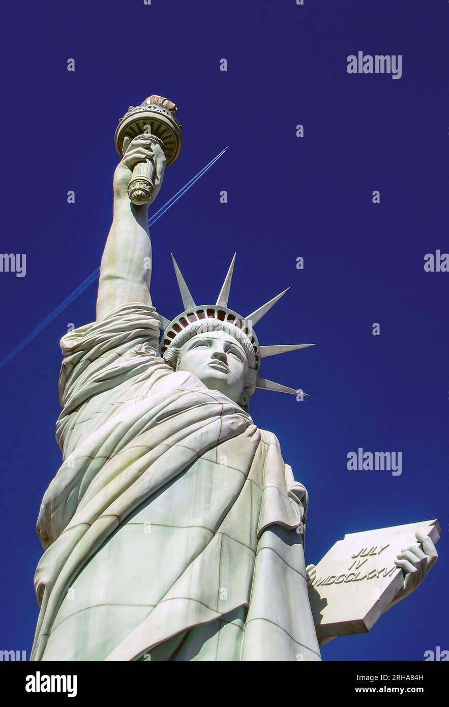 A jet soars over the Statue of Liberty Stock Photo - Alamy