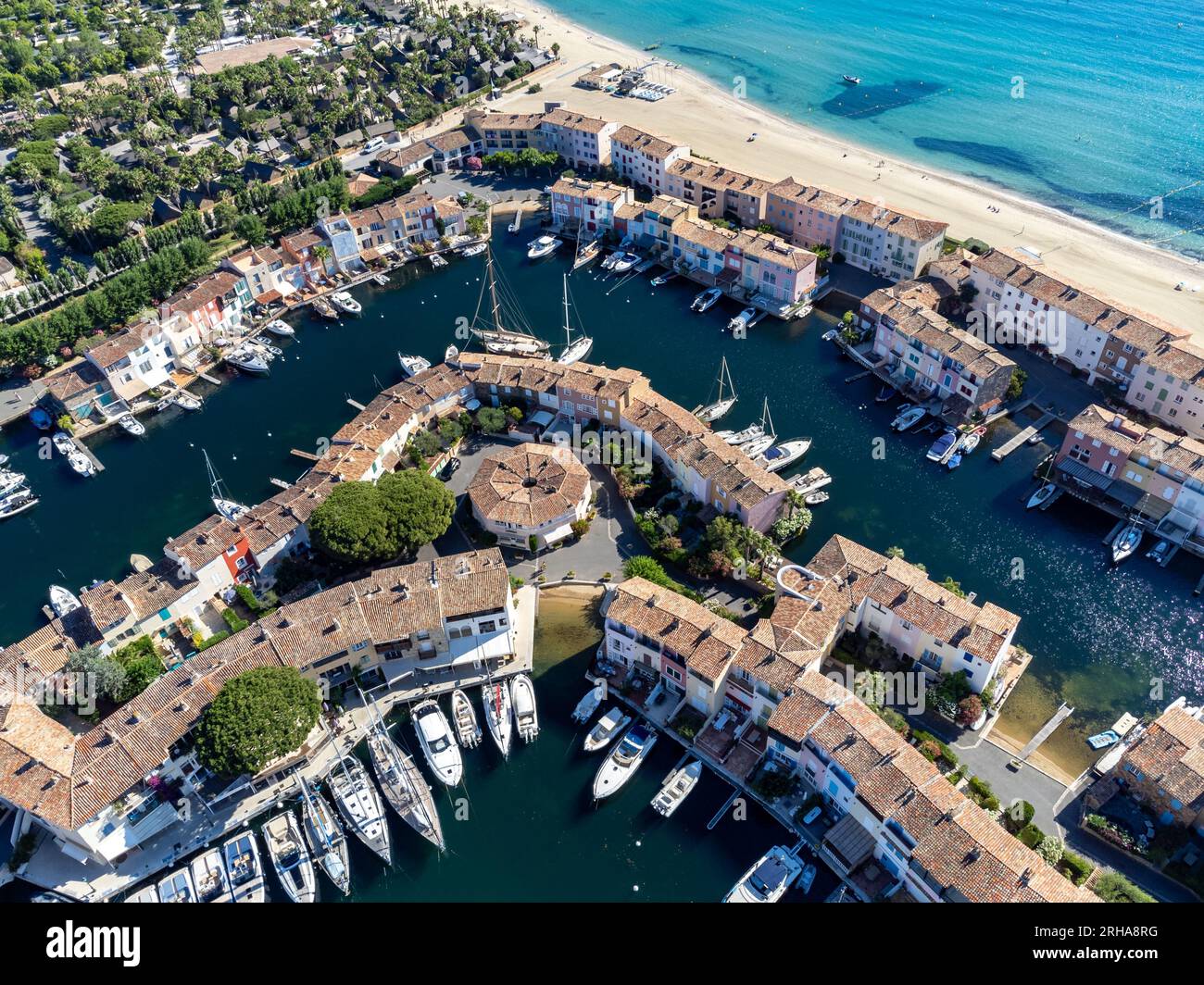 Arial view on blue water of Gulf of Saint-Tropez, boats, houses in Port ...
